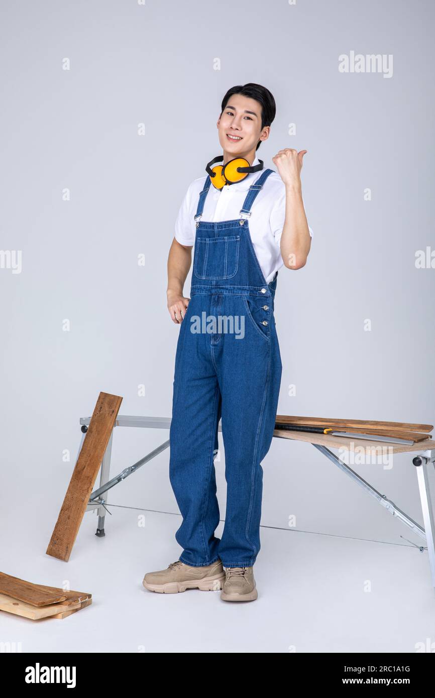 millennials and gen z, korean asian young man carpenter standing Stock ...