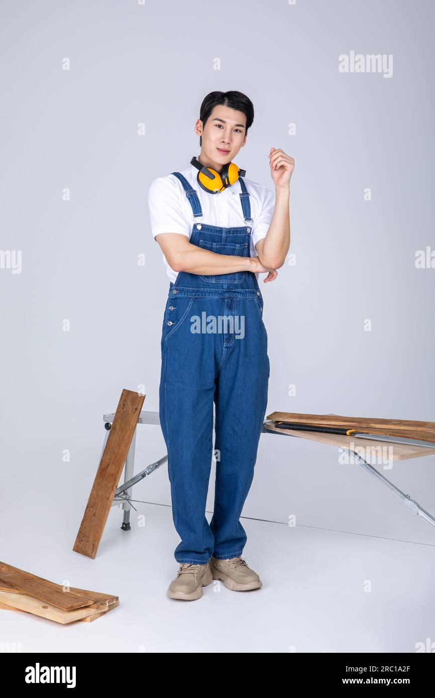 millennials and gen z, korean asian young man carpenter standing Stock ...