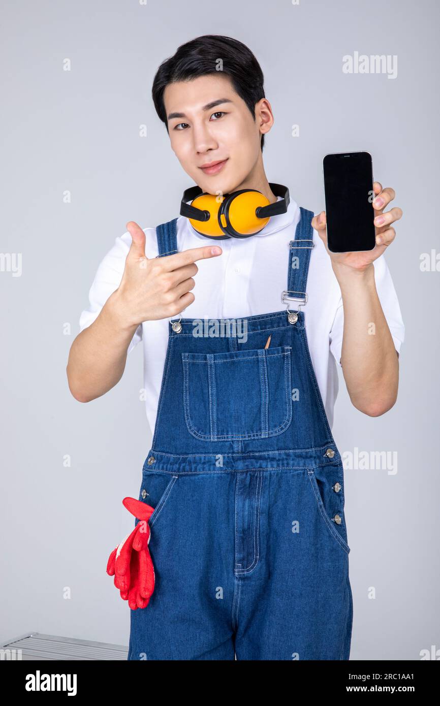 millennials and gen z, korean asian young man carpenter with a ...