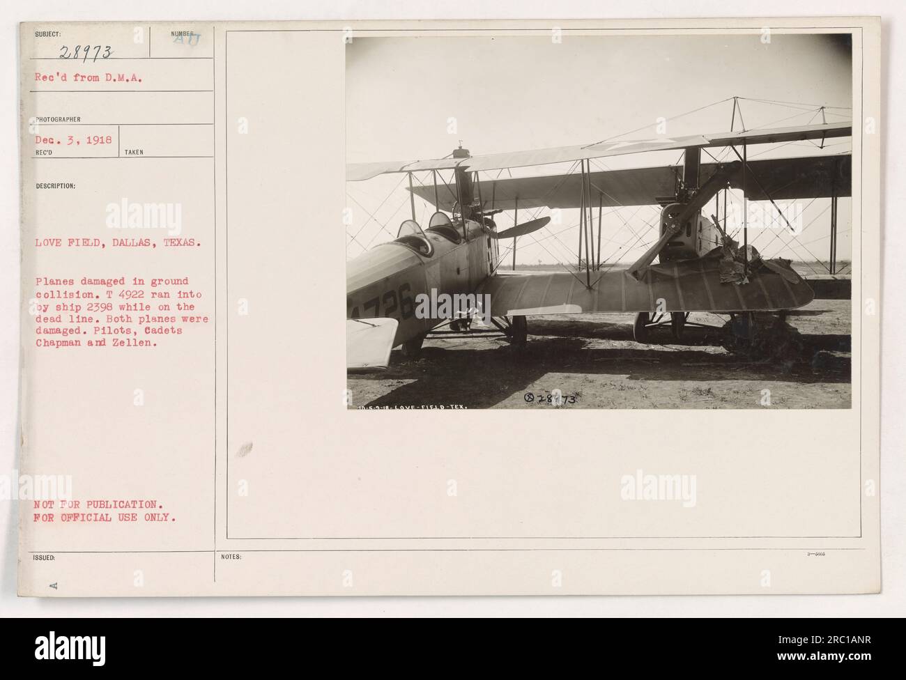 Photograph 28973 shows two damaged planes at Love Field in Dallas ...