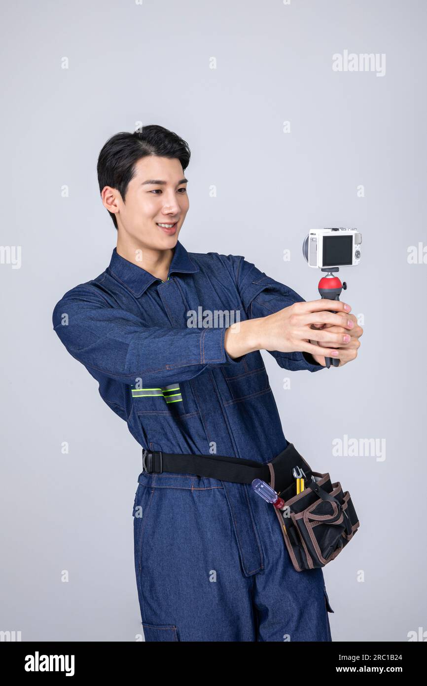 millennials and gen z, korean asian young man, site staff filming Stock ...
