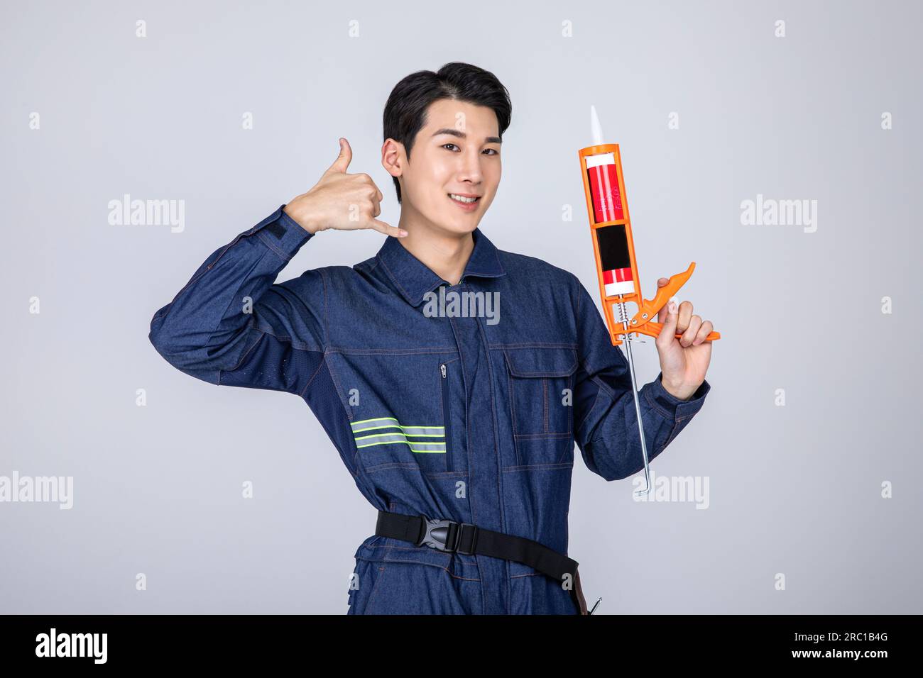 millennials and gen z, korean asian young man, site staff with caulking ...