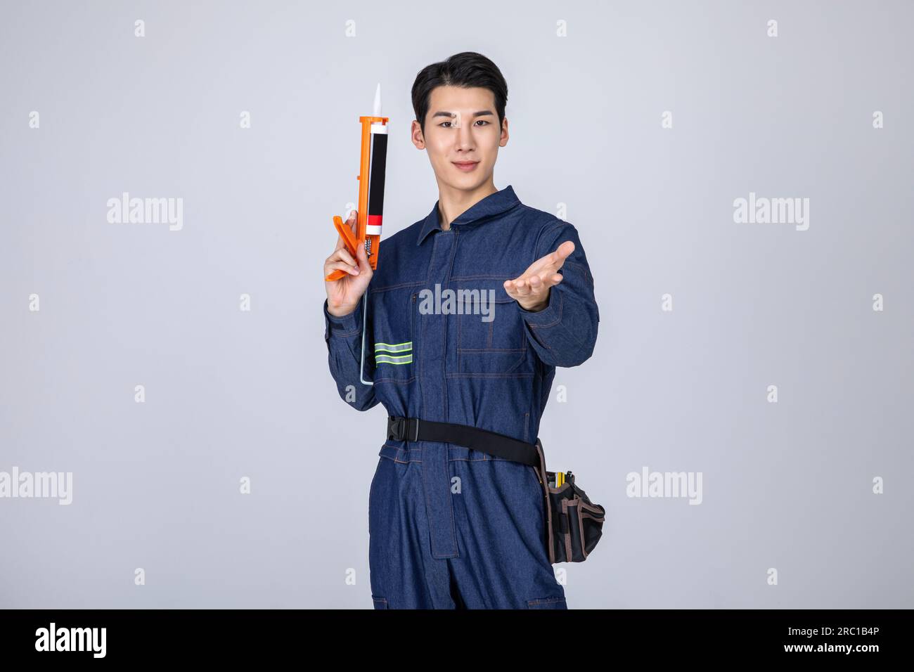 millennials and gen z, korean asian young man, site staff with caulking ...