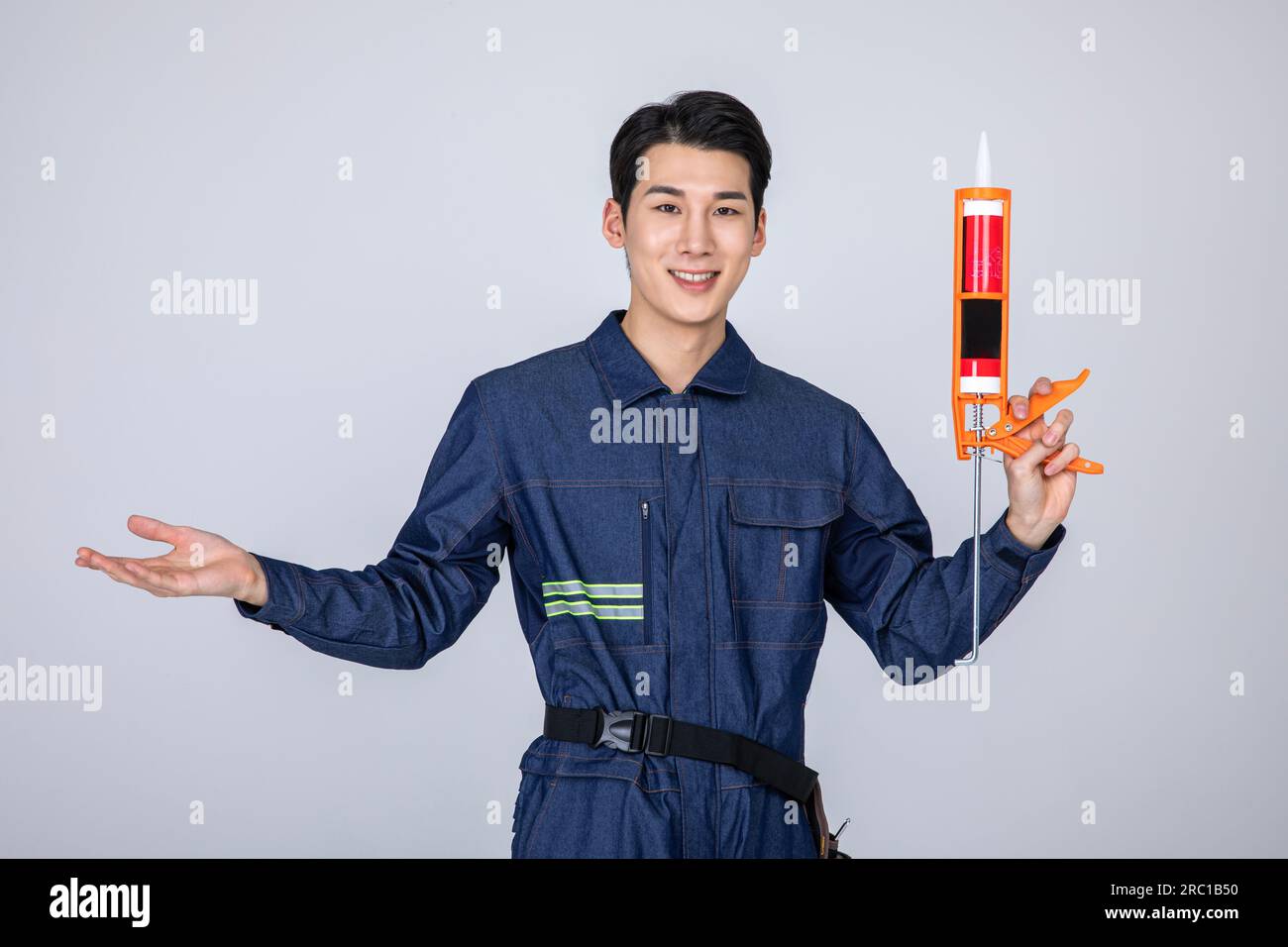 millennials and gen z, korean asian young man, site staff with caulking ...