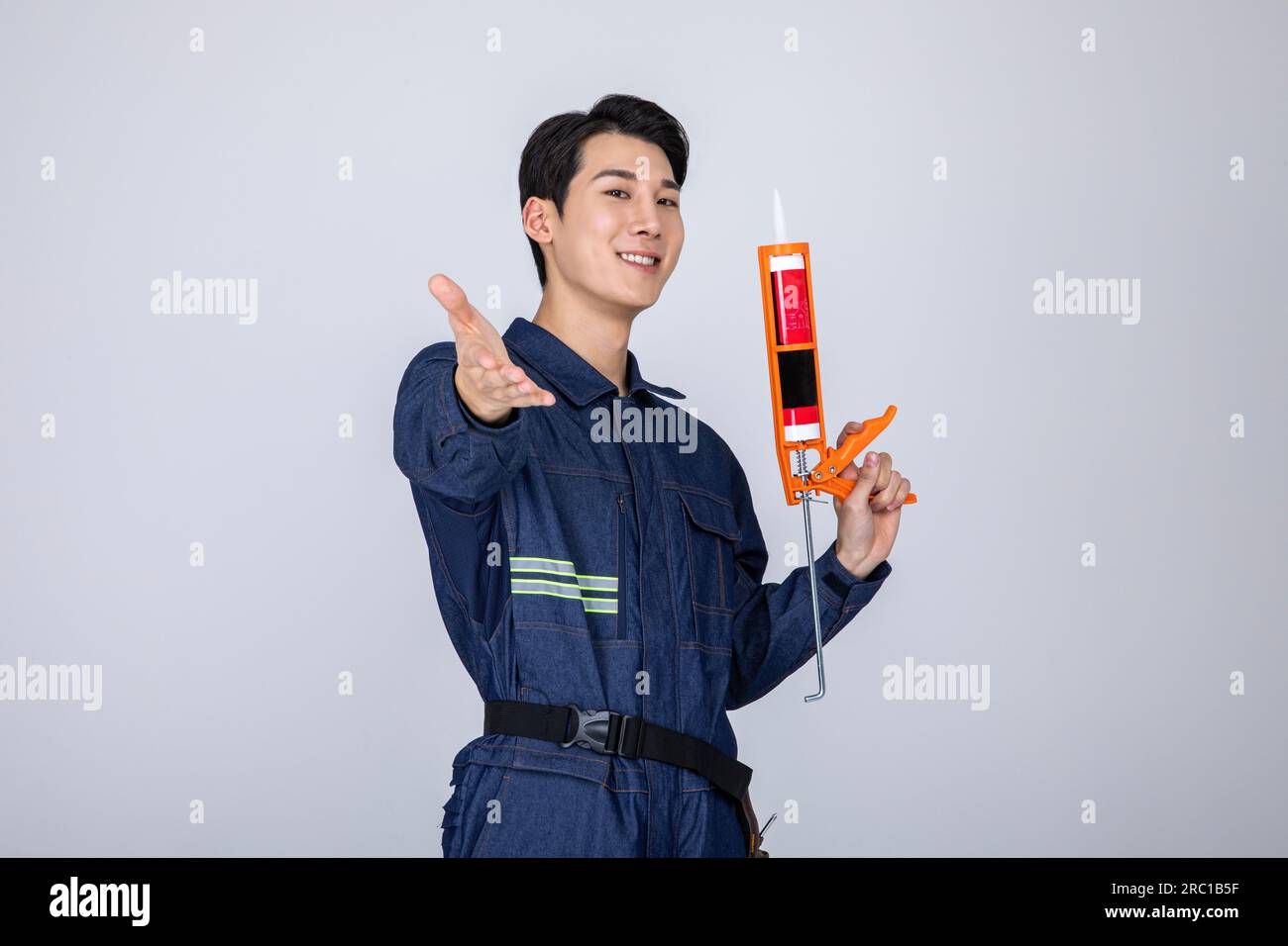 millennials and gen z, korean asian young man, site staff with caulking ...