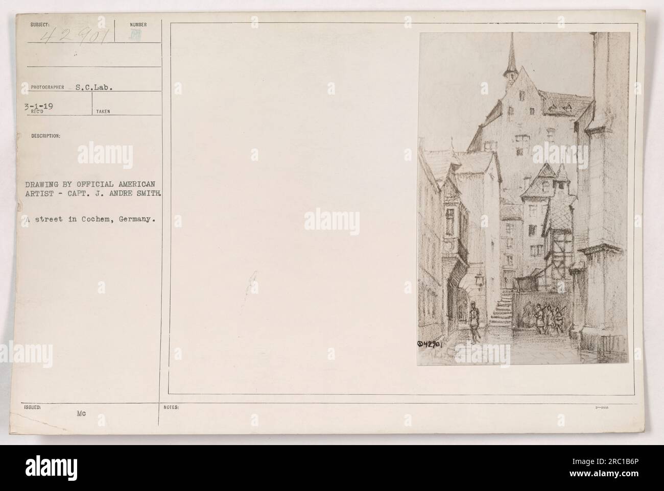 American artist Capt. J. Andre Smith holds up a drawing depicting a ...