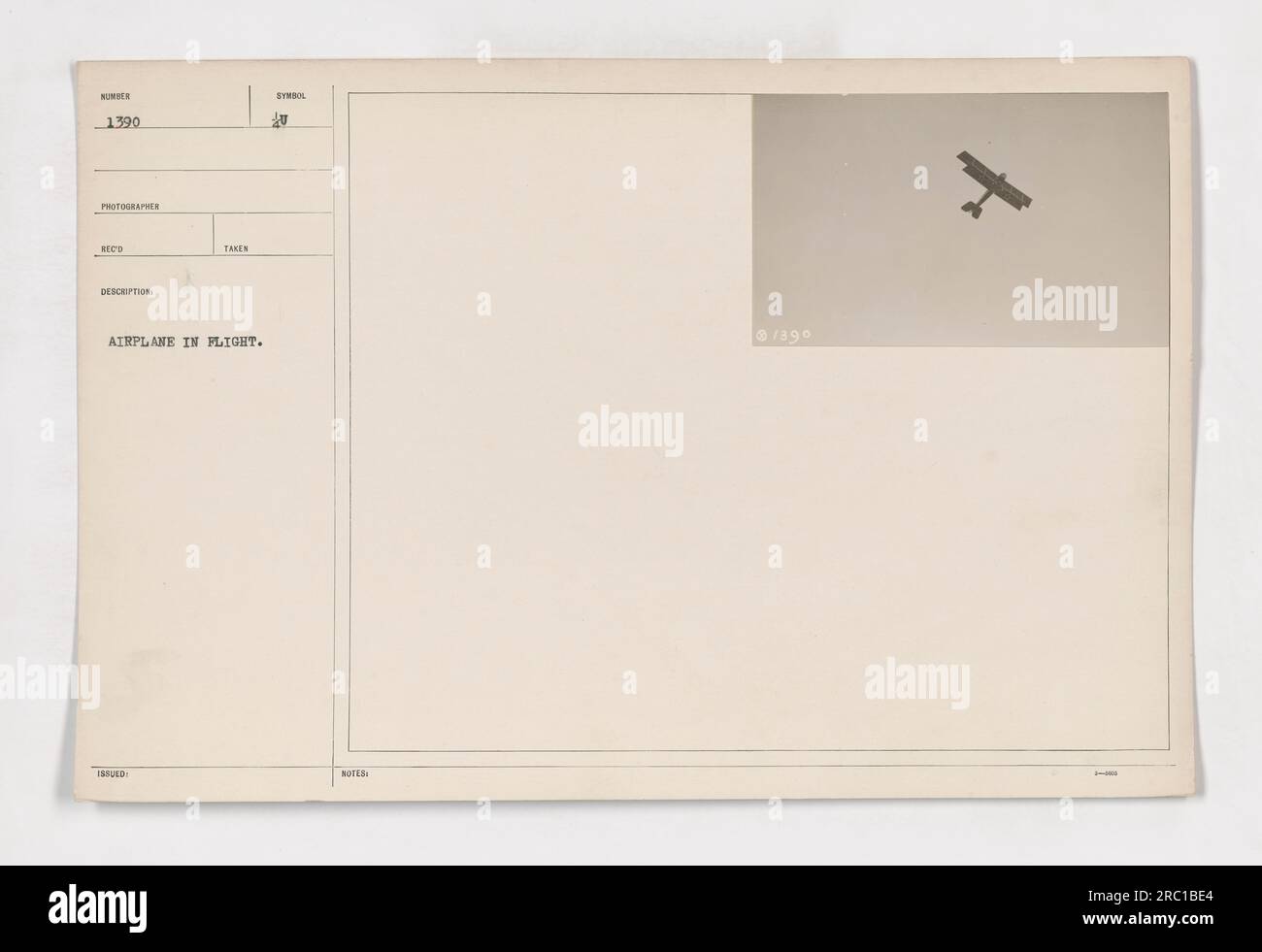 Image: A black and white photograph showing an airplane in flight. The ...