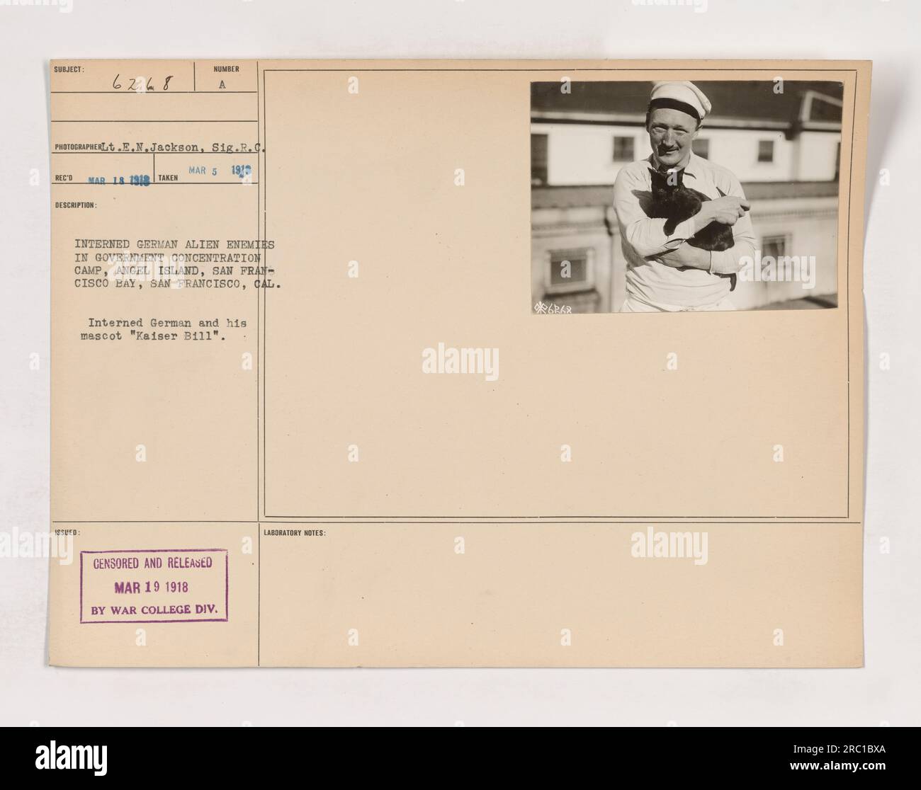 An interned German alien enemy and his mascot, "Kaiser Bill," at a ...