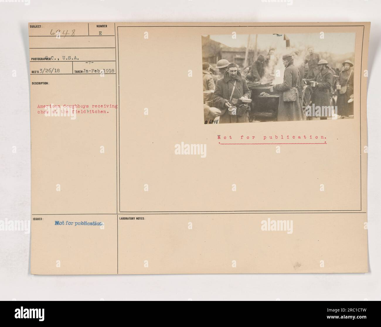 Soldiers from the First Division of the U.S. Army receiving meals at a ...