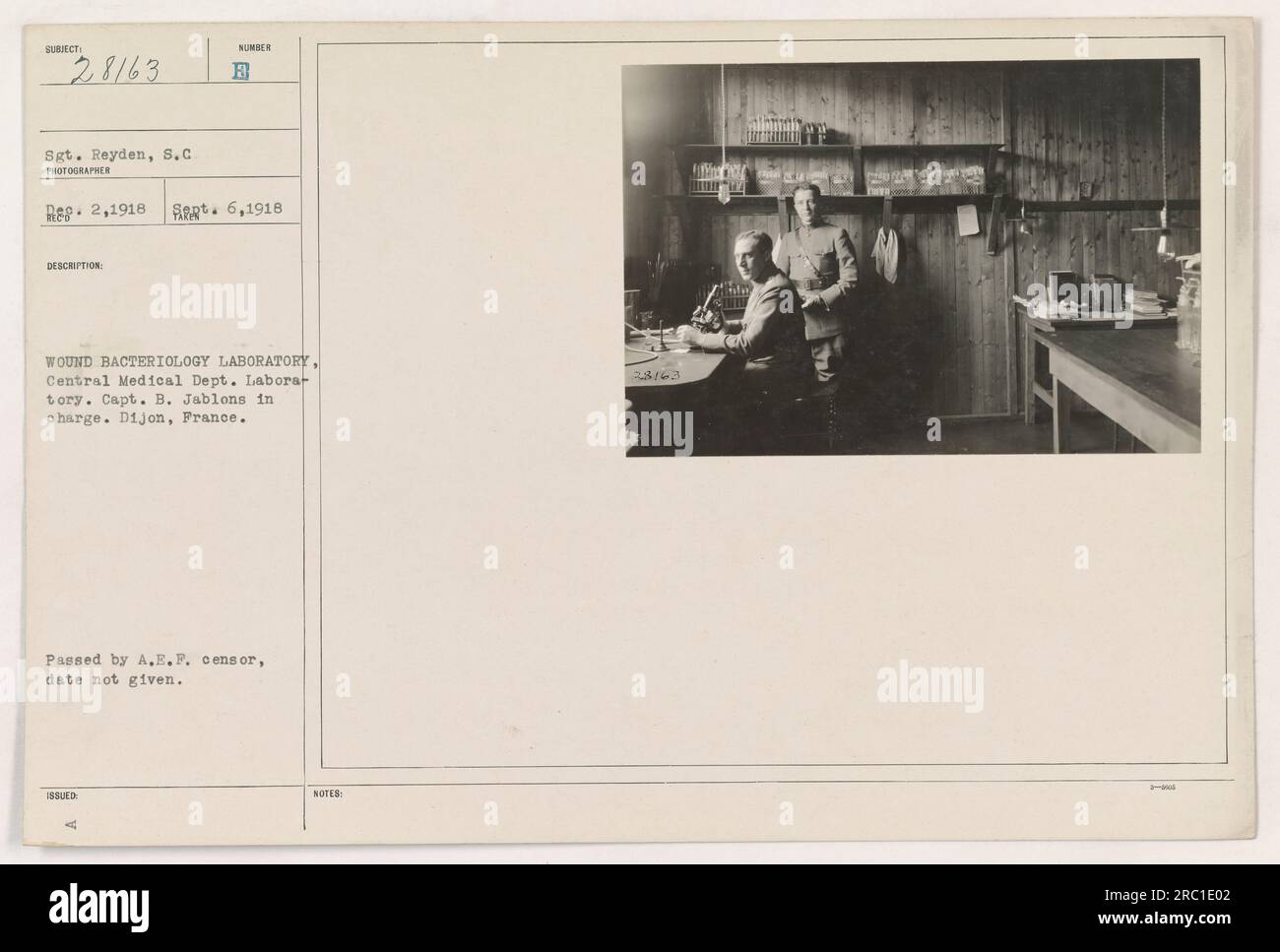 The photograph shows Sgt. Reyden in the Wound Bacteriology Laboratory ...