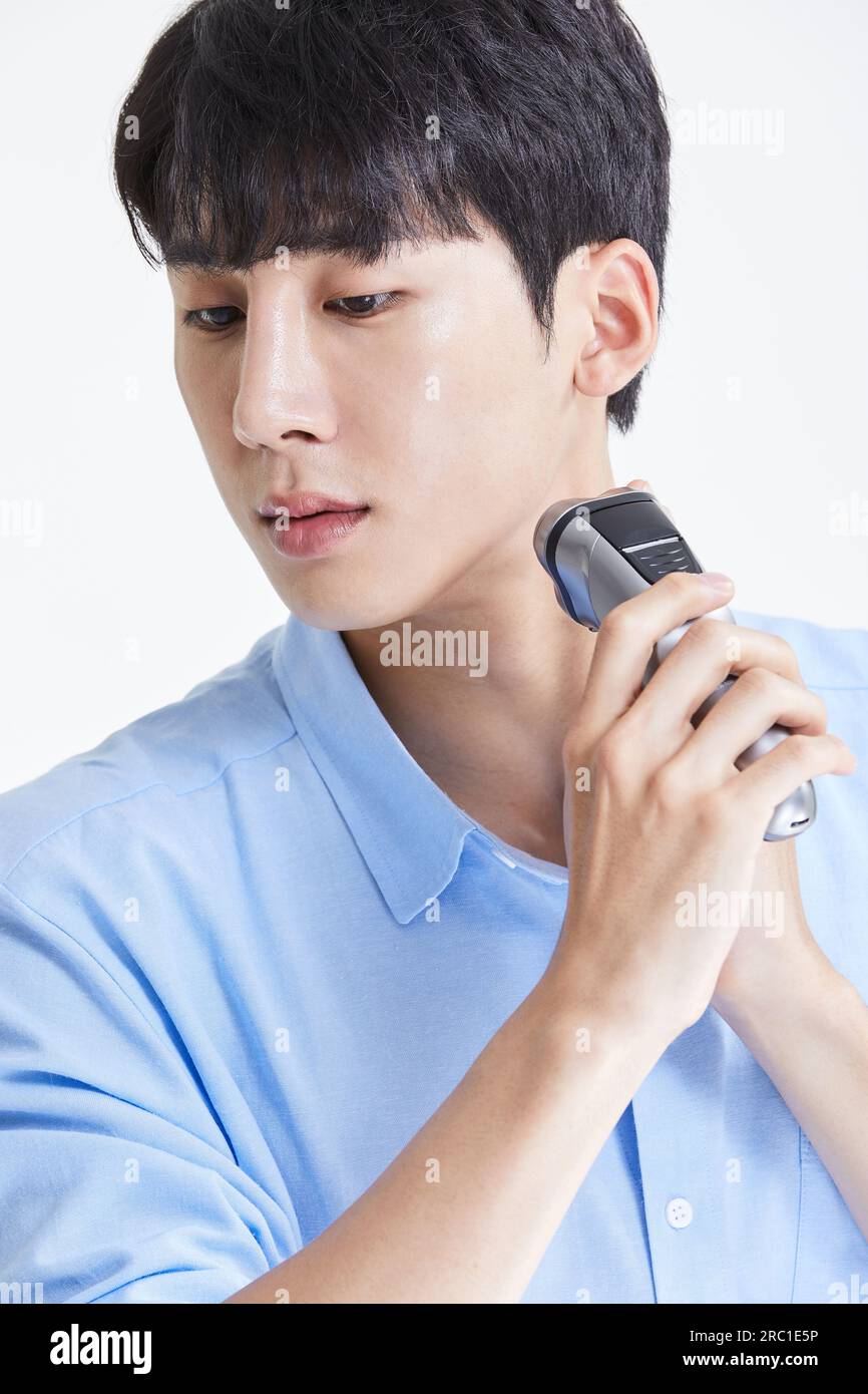 korean asian young man with razor Stock Photo - Alamy