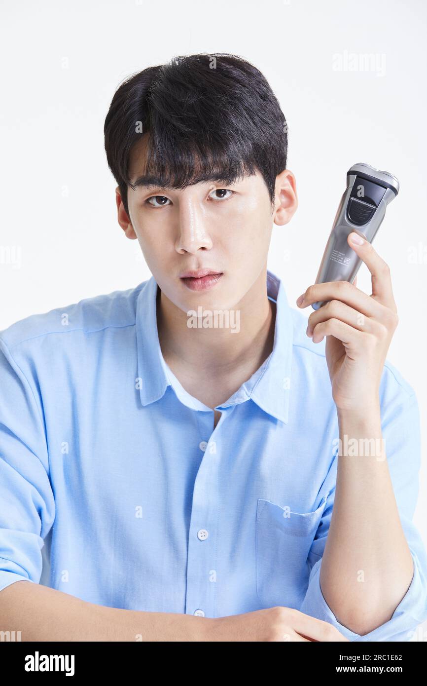 korean asian young man with razor Stock Photo - Alamy