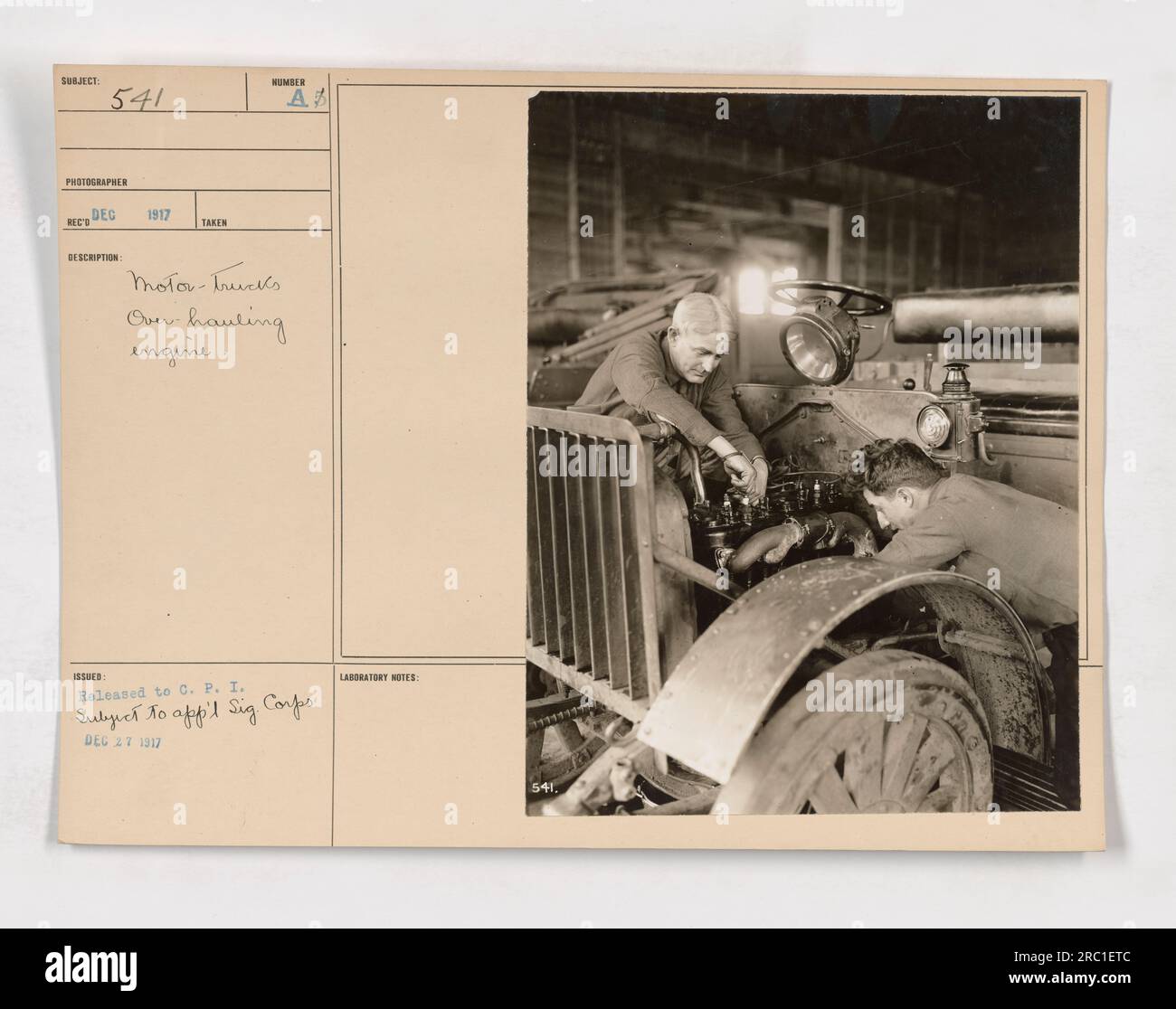 "Motor trucks undergoing engine overhauling. Photograph taken in ...