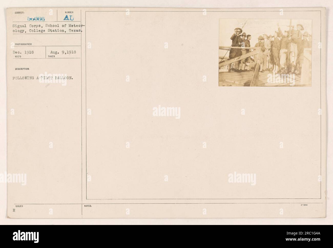 A pilot balloon being observed by military personnel at the School of ...