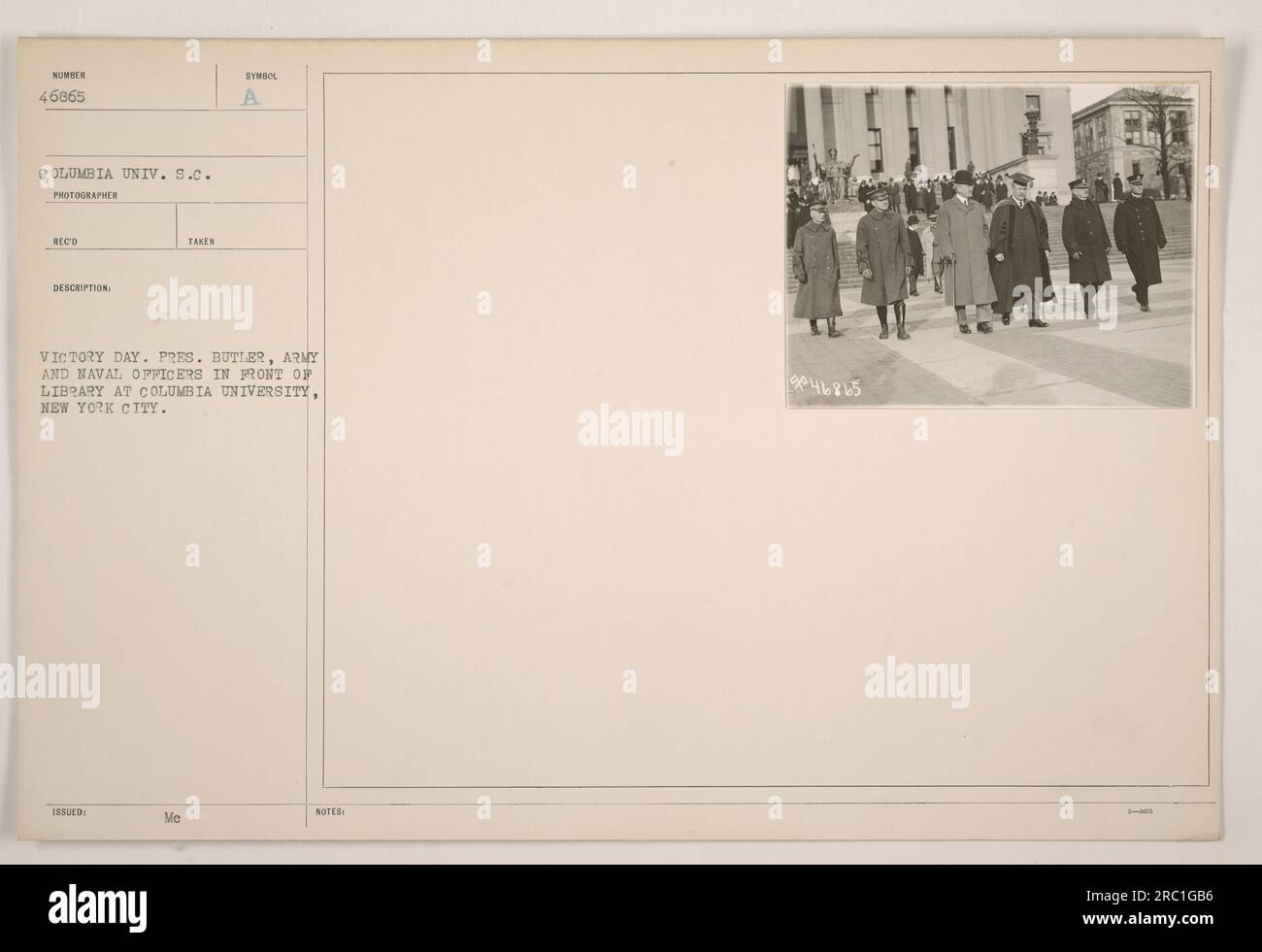 President Butler and army and naval officers stand in front of the ...