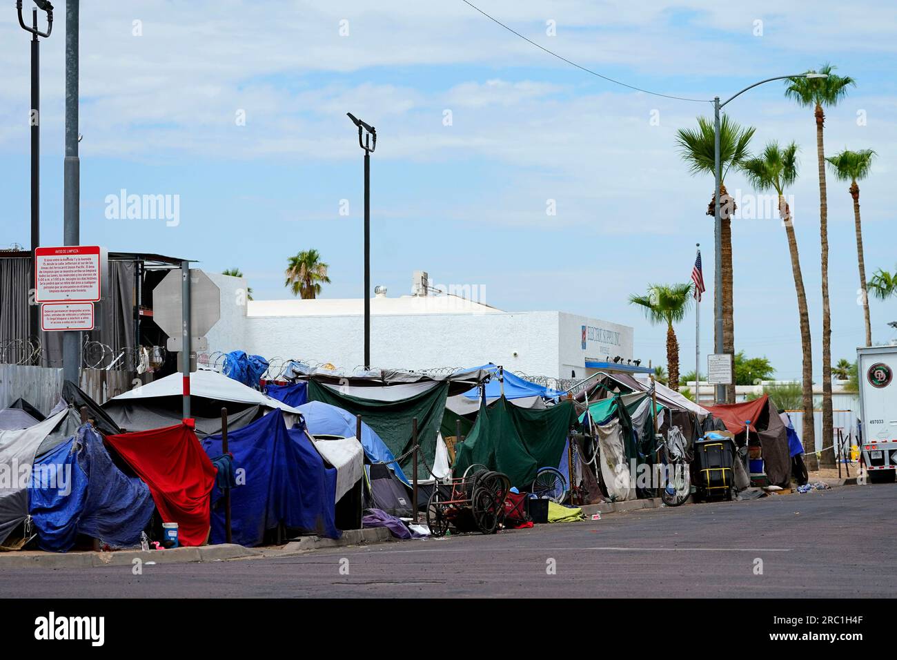 Tents line the street of "The Zone," a homeless encampment, Tuesday ...