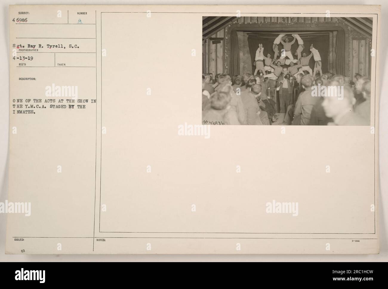 An act at a show in the Y.M.C.A., staged by the inmates. The photograph ...