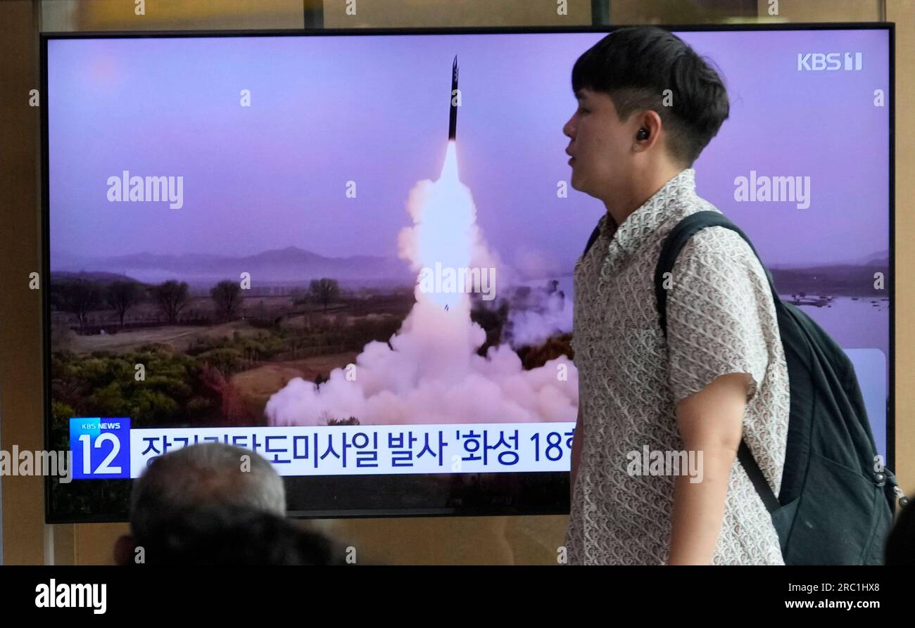 A TV screen shows a file image of North Korea's missile launch during a ...