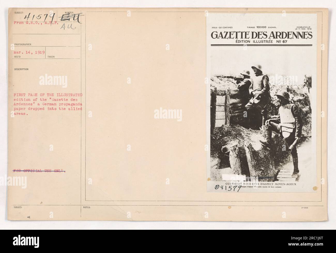 Soldiers reading the first page of the German propaganda paper ...