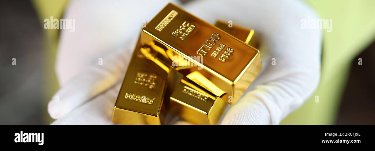 Gold bars in hand hi-res stock photography and images - Alamy