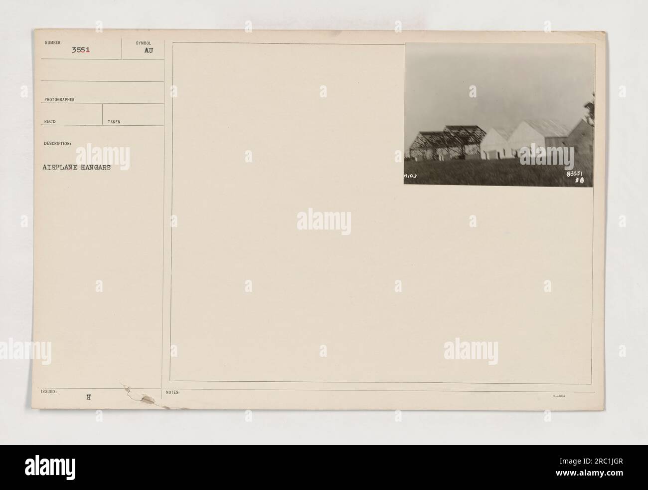 This photograph shows a row of airplane hangars during World War One ...