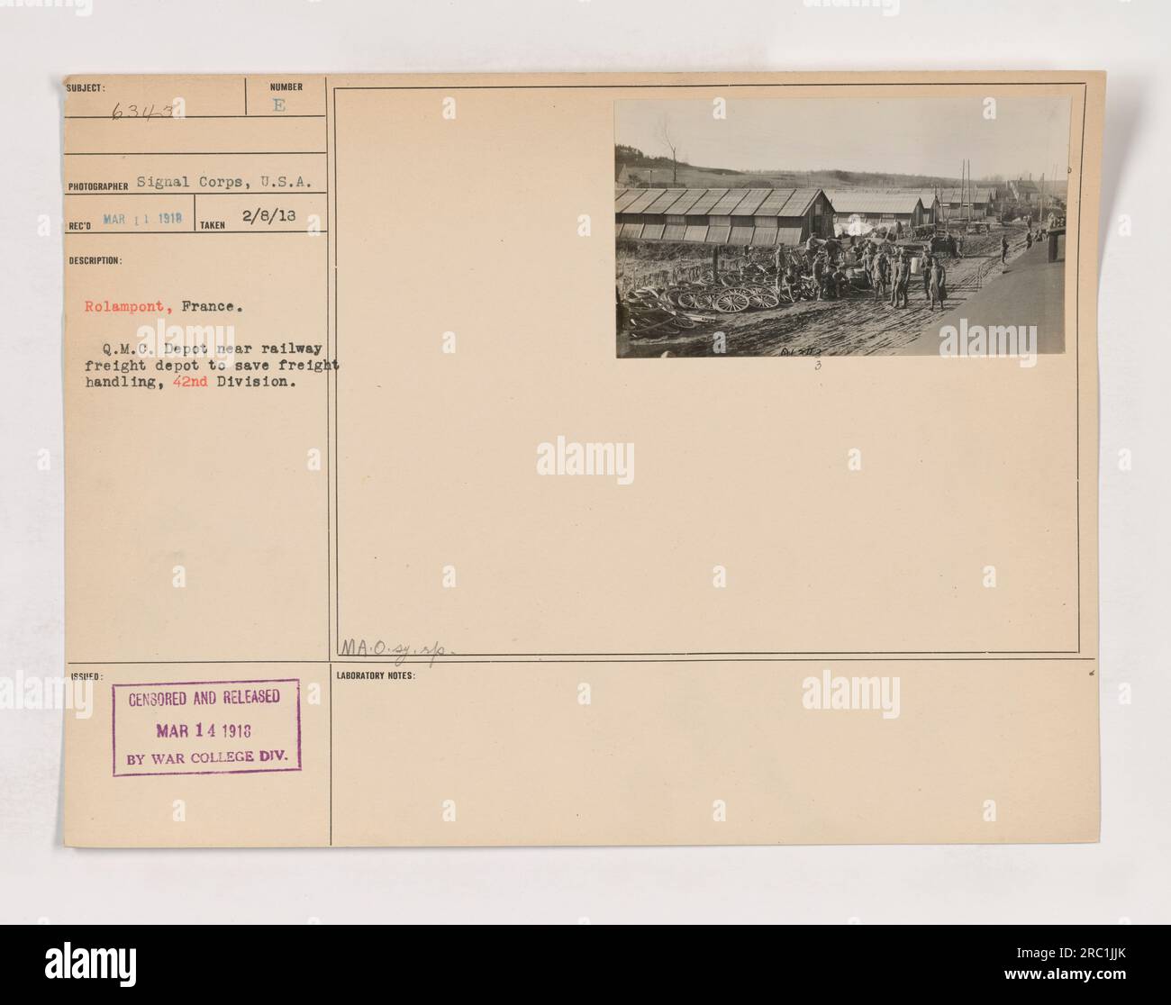 This photograph shows a Quartermaster depot located near a railroad ...