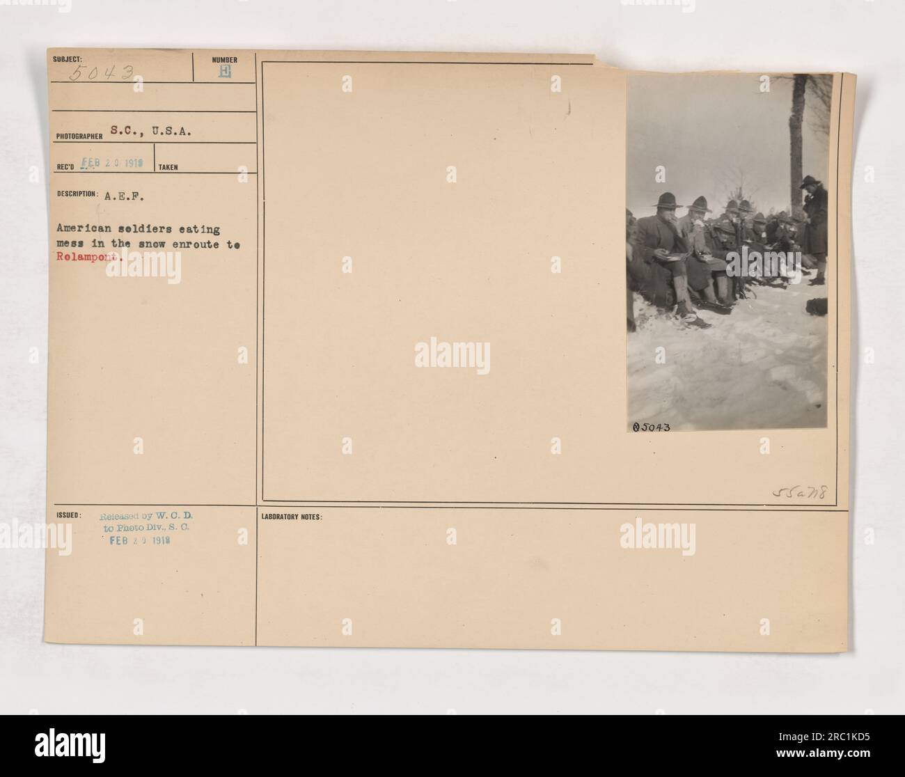 American soldiers are seen eating in the snow while en route to ...
