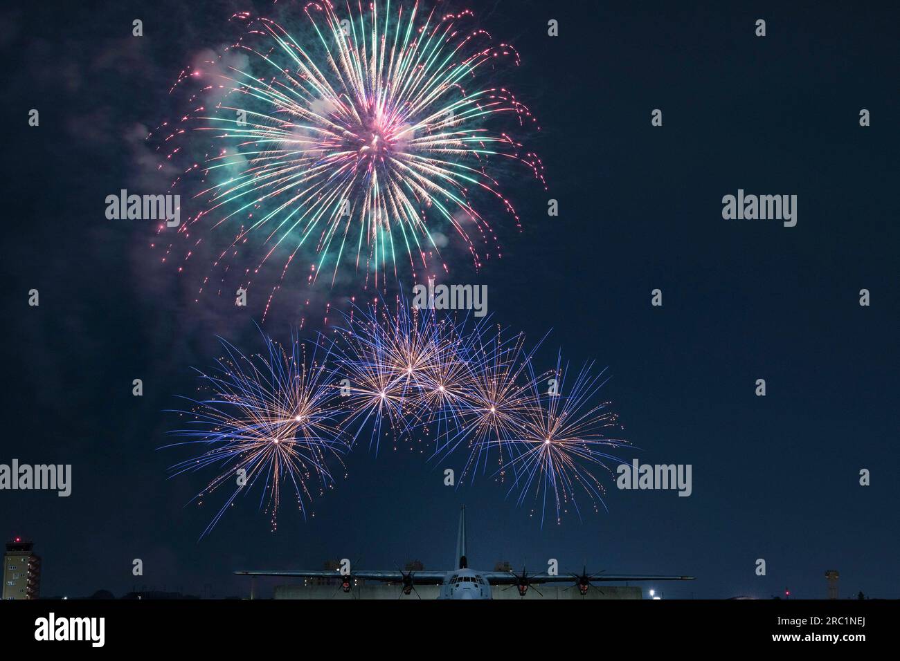 Yokota Air Base, Japan. 3rd July, 2023. Fireworks explode behind an Air ...