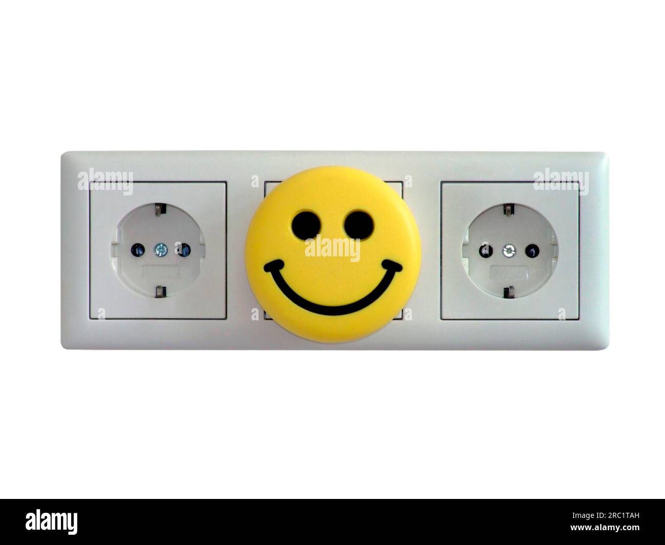 Electric sockets and a smile face Stock Photo - Alamy