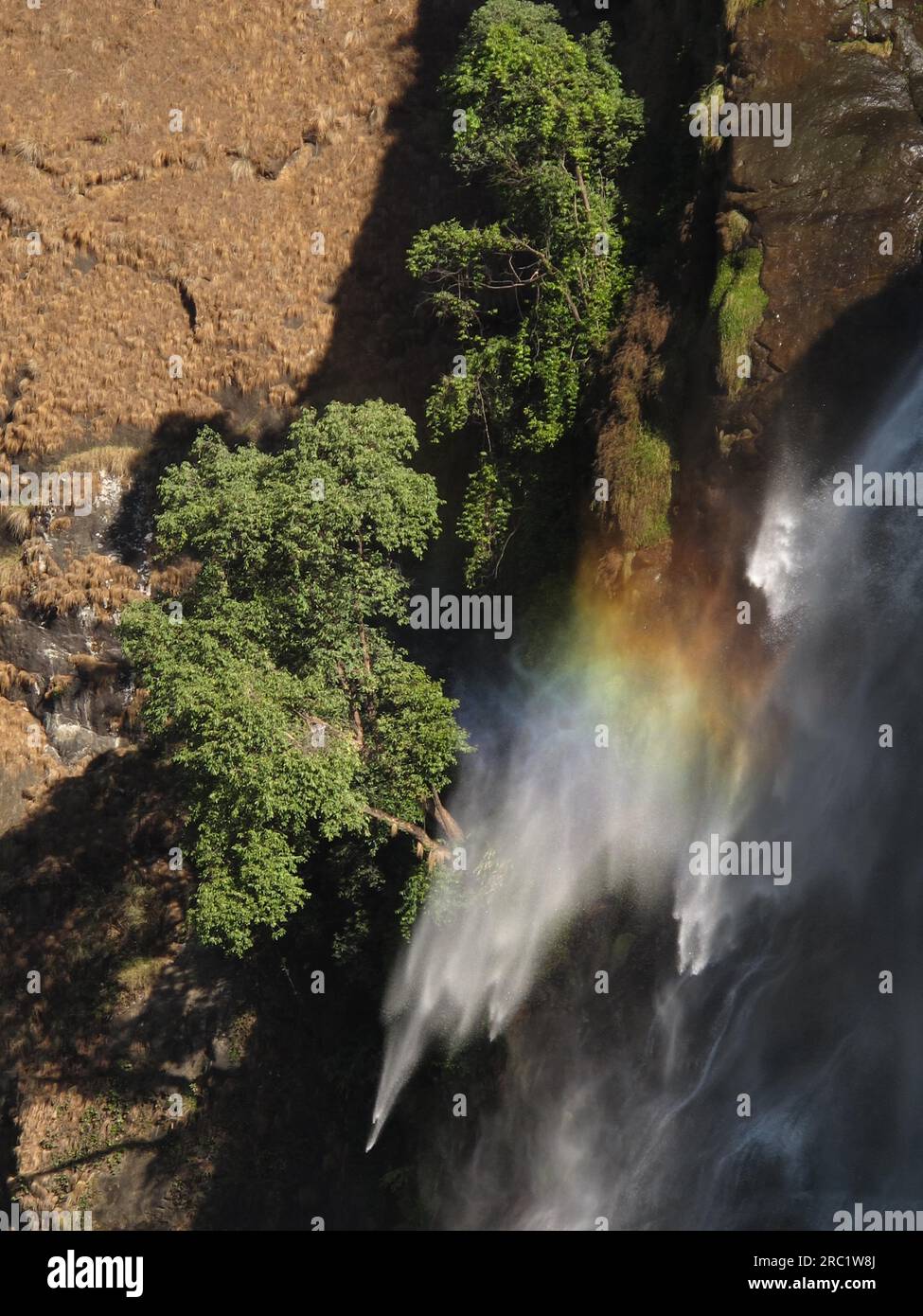 Rainbow caused by a waterfall Stock Photo - Alamy