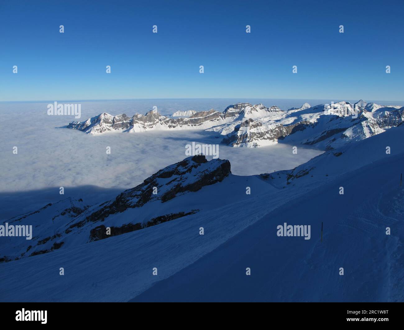 Morning on the Titlis. Mountains and sea of fog Stock Photo - Alamy