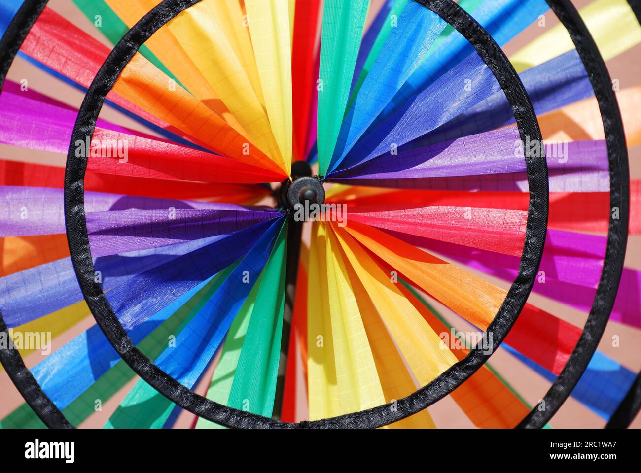 Detail of a colourful pinwheel in rainbow colours Stock Photo - Alamy