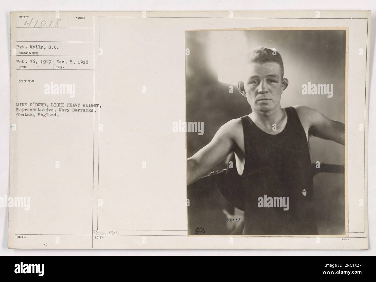 Private Kelly, S.C., snaps a photo of Mike O'Dowd, a light heavyweight boxer and Navy ...