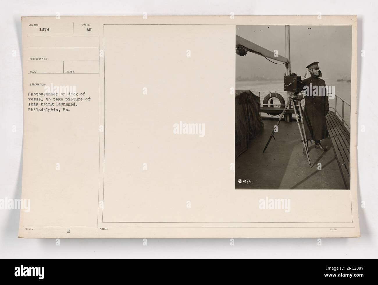 Photographer on deck of a vessel preparing to capture an image of a ...