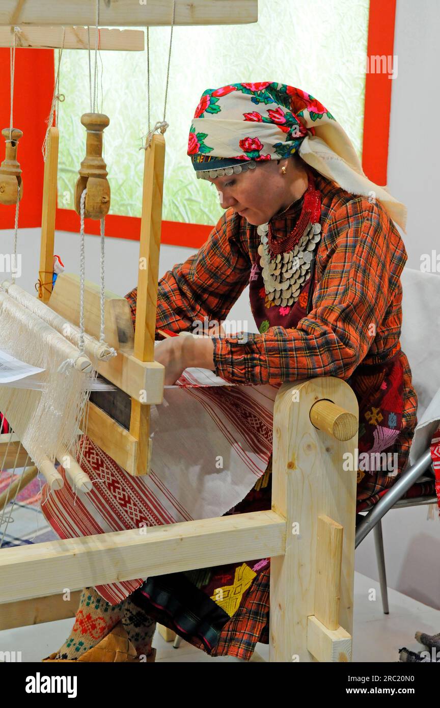 Caucasian woman weaving, weaver, handwork, loom Stock Photo - Alamy