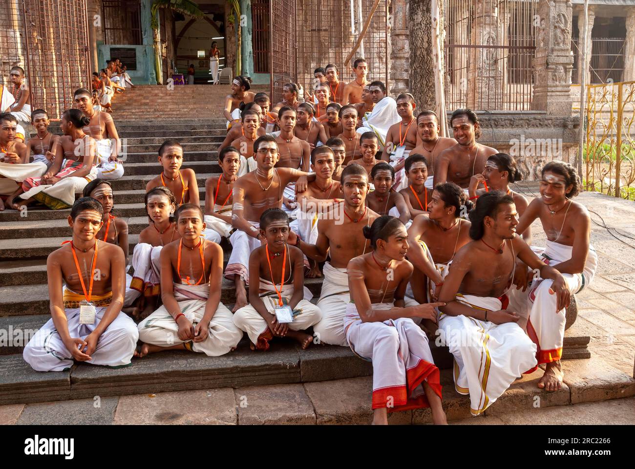 Students of vedic school sitting the steps in Nataraja temple, Chidambaram, Tamil Nadu, South ...