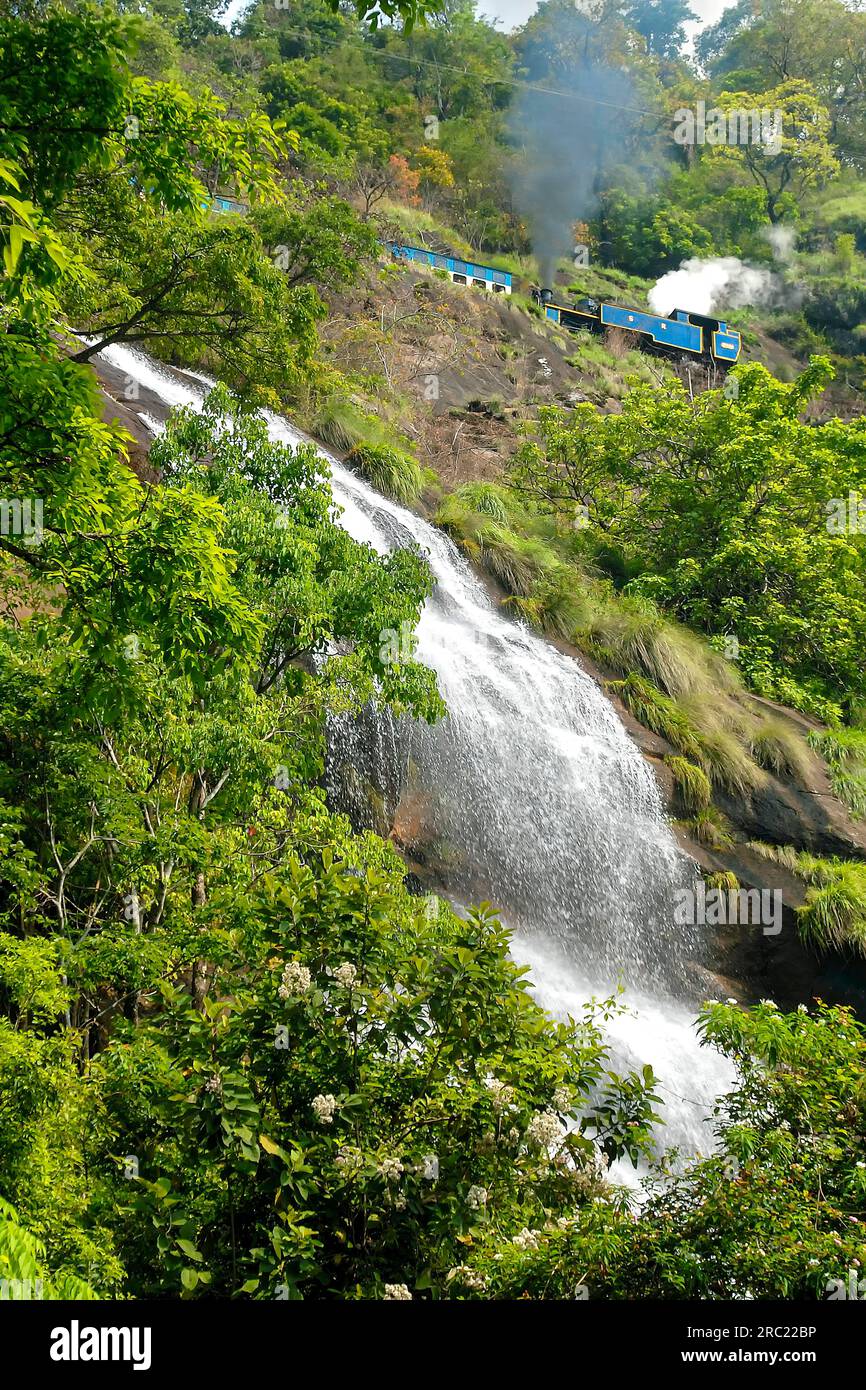 A waterfall during monsoon season and a Nilgiri mountain railway hill ...