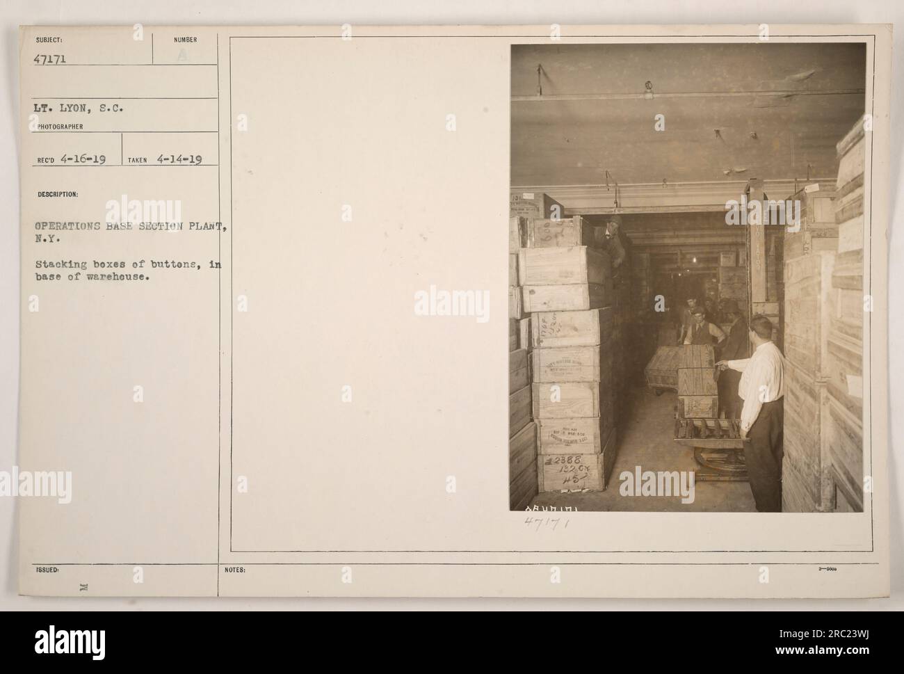 Soldiers at the Operations Base Section Plant in New York stack boxes ...