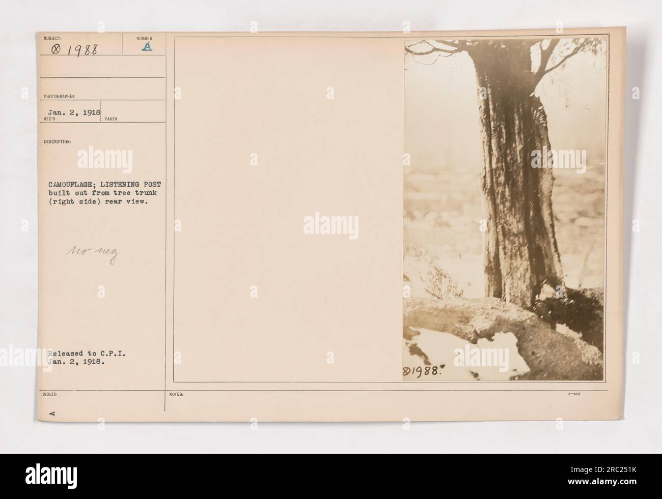 "Photograph of a camouflage listening post built from a tree trunk ...