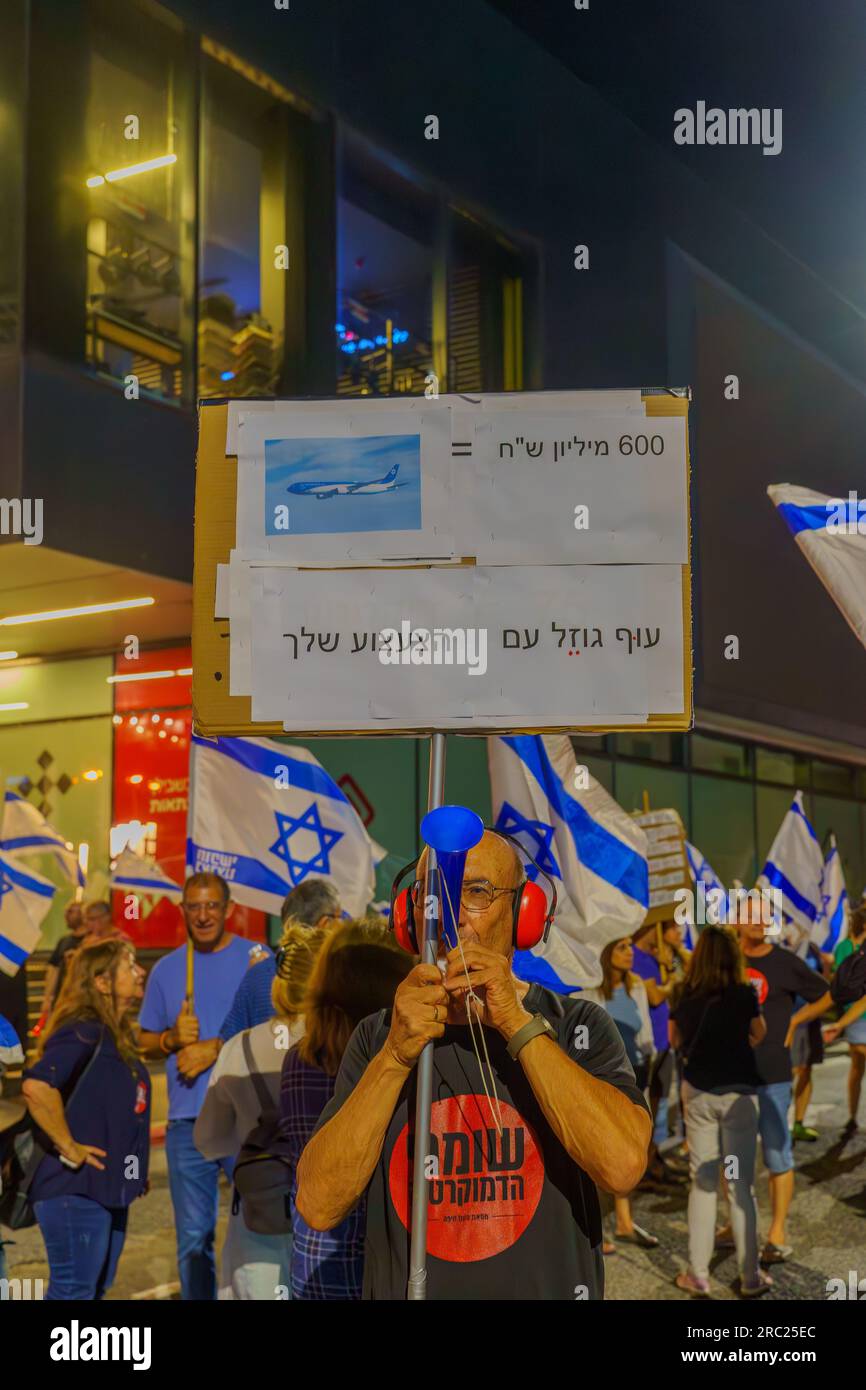 Haifa, Israel - July 11, 2023: People protest with flags and various ...