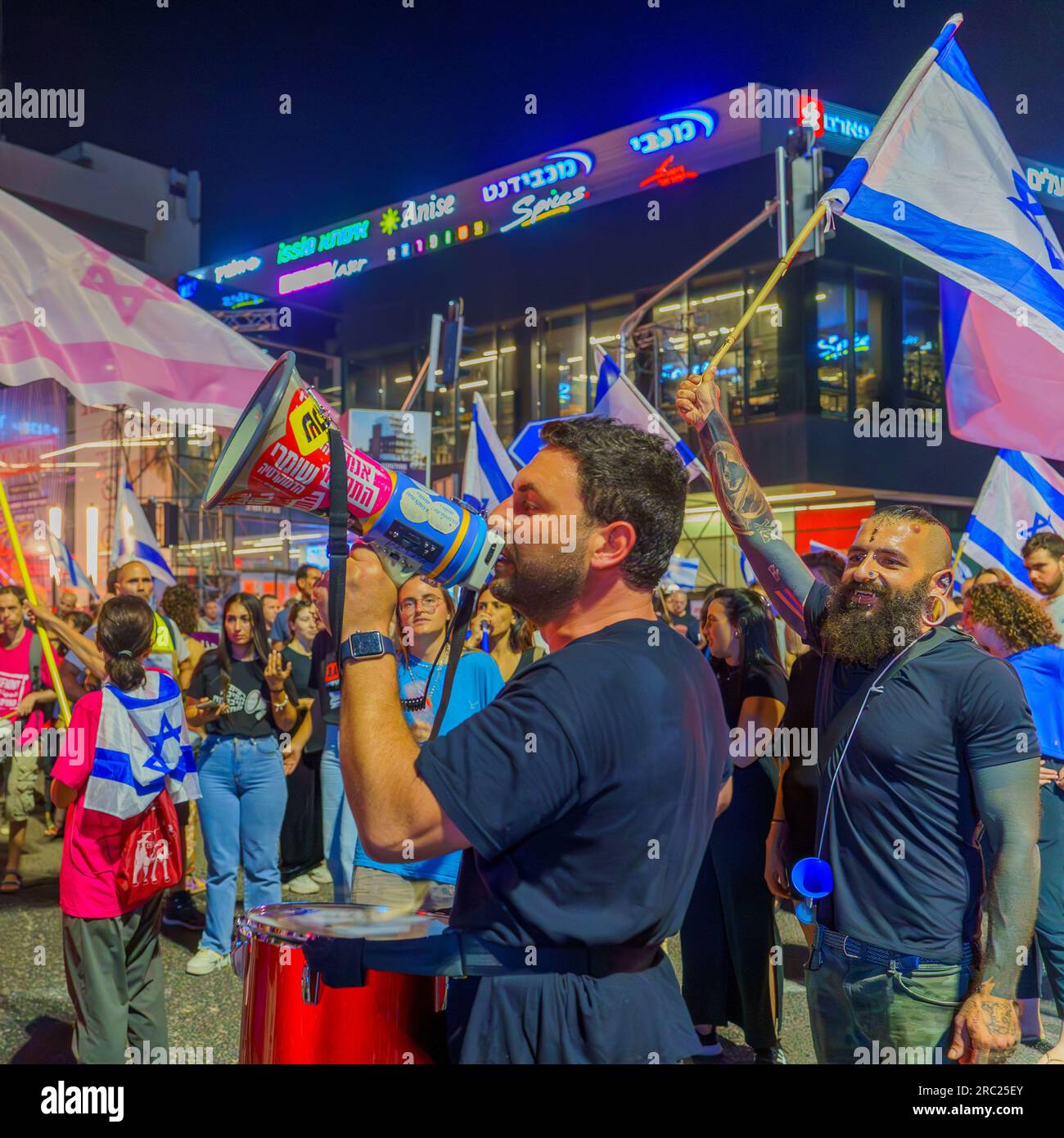 Haifa, Israel - July 11, 2023: People protest with flags and various ...