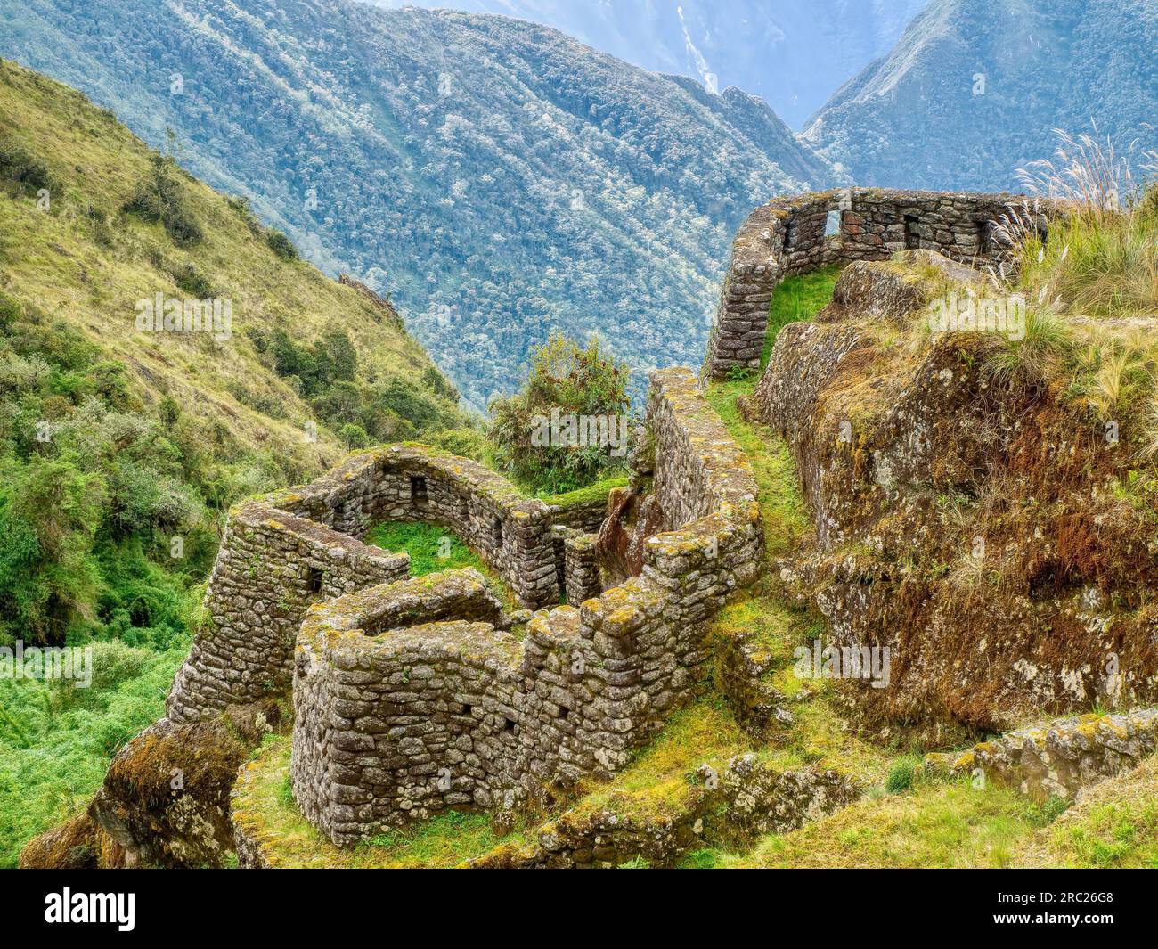 On the Inca Trail in Peru, old ruins of an Inkan stone building, shaped ...