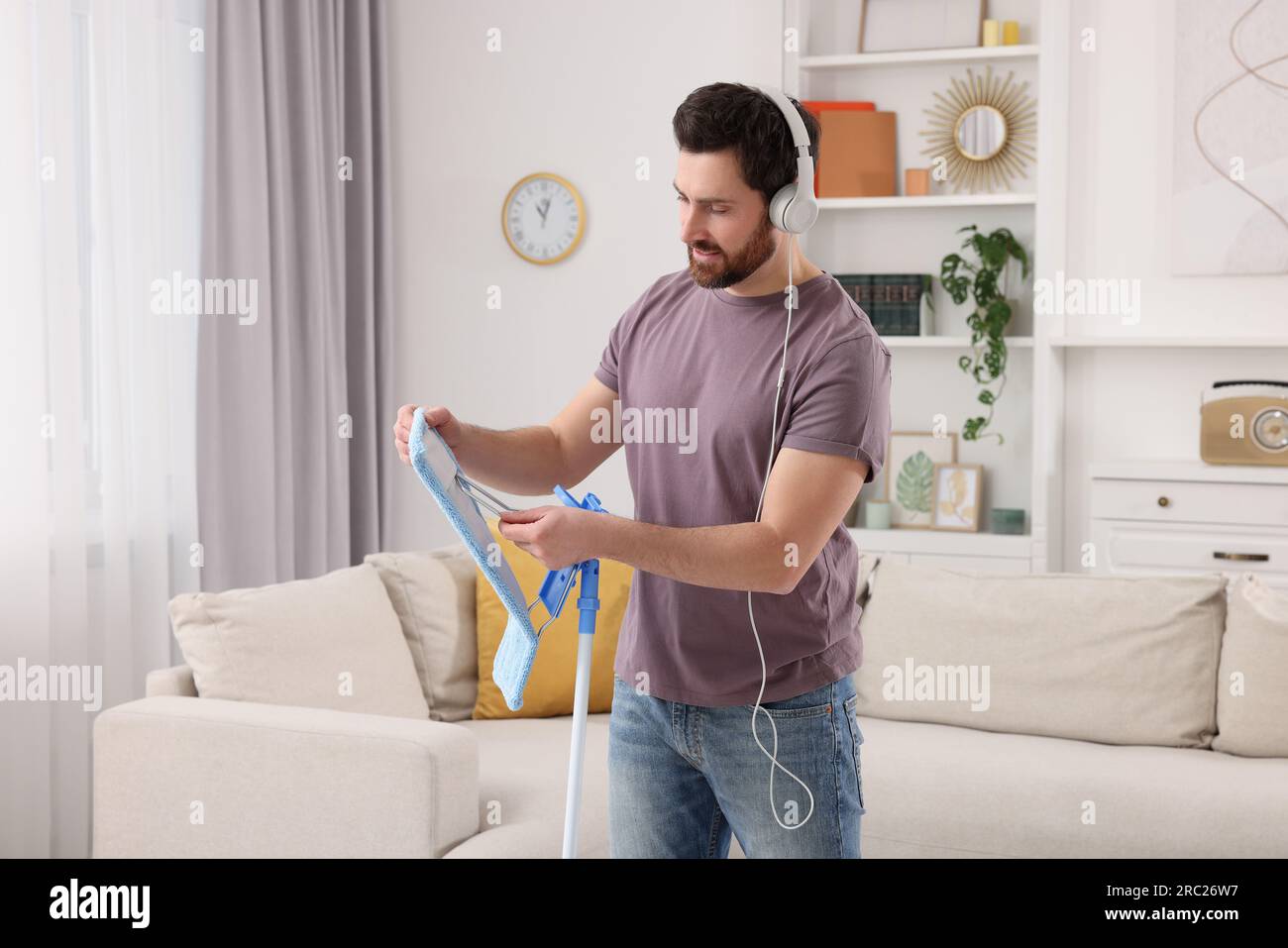 Spring cleaning man headphones hi-res stock photography and images - Alamy