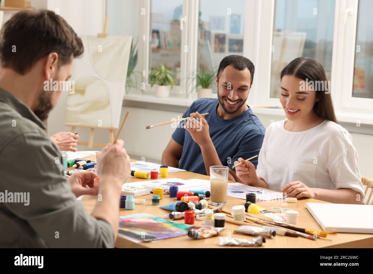 Group of students attending painting class in studio. Creative hobby ...