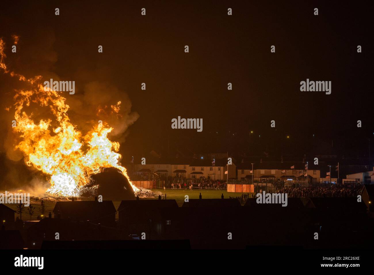 People watch the burning of the Craigyhill loyalist bonfire in Larne ...