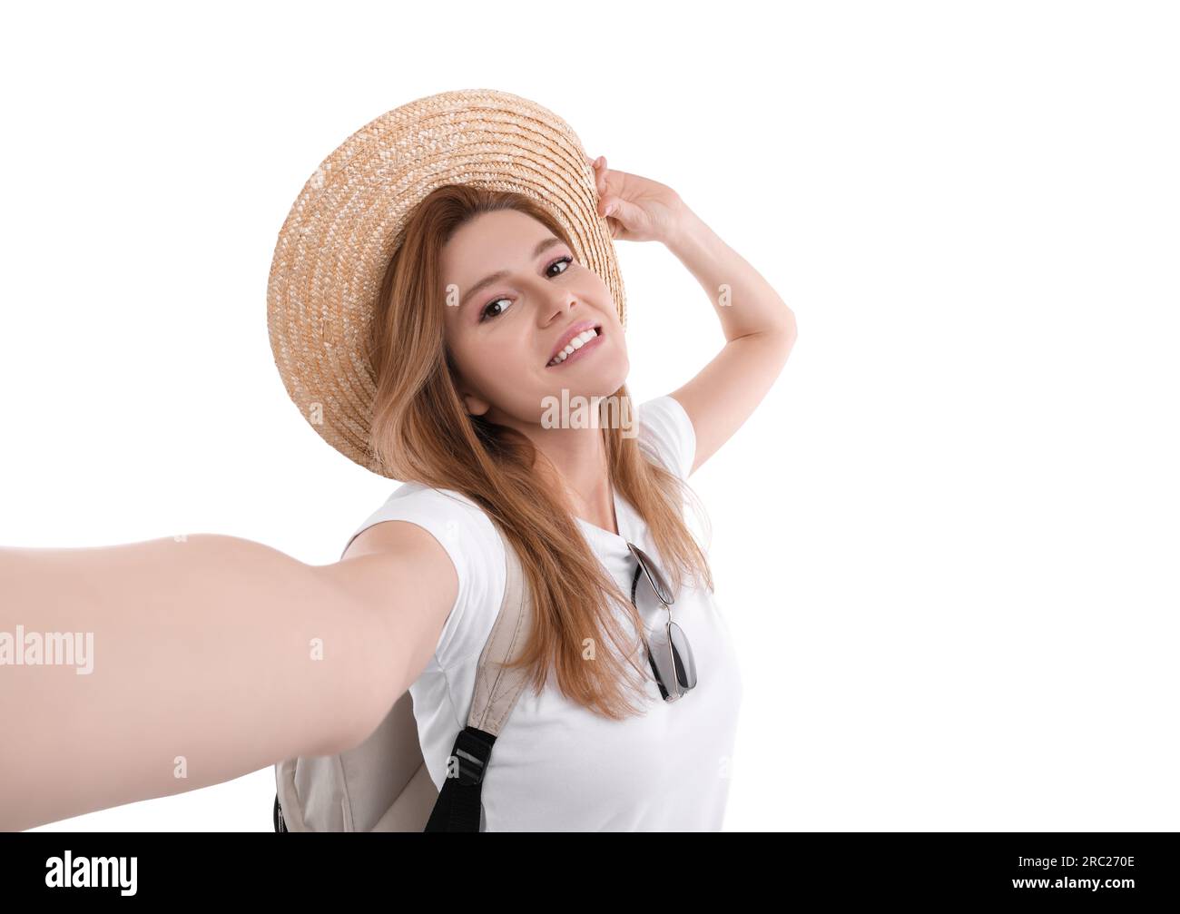 Beautiful woman in straw hat taking selfie on white background Stock ...