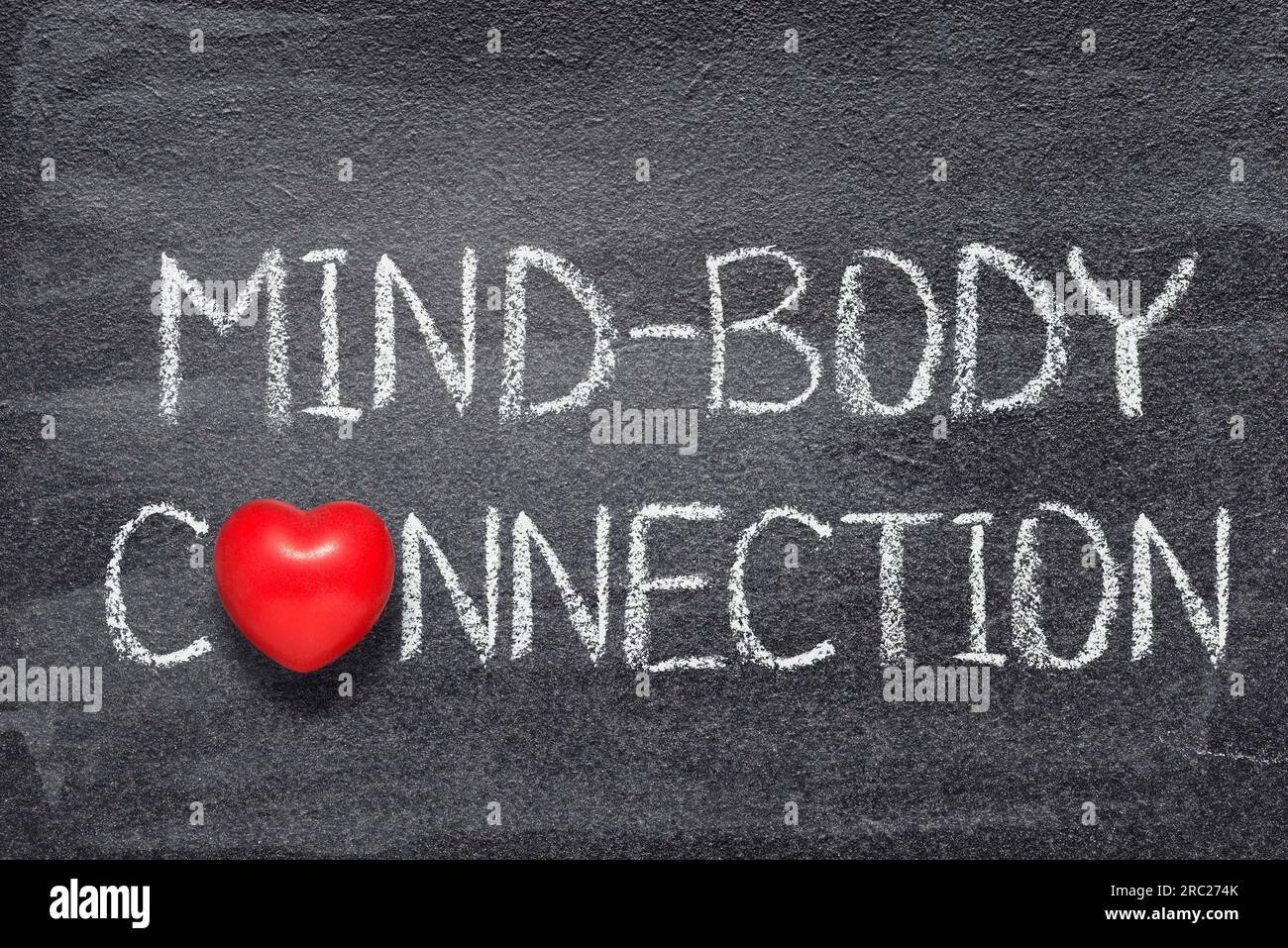 mind-body connection phrase written on chalkboard with red heart symbol ...