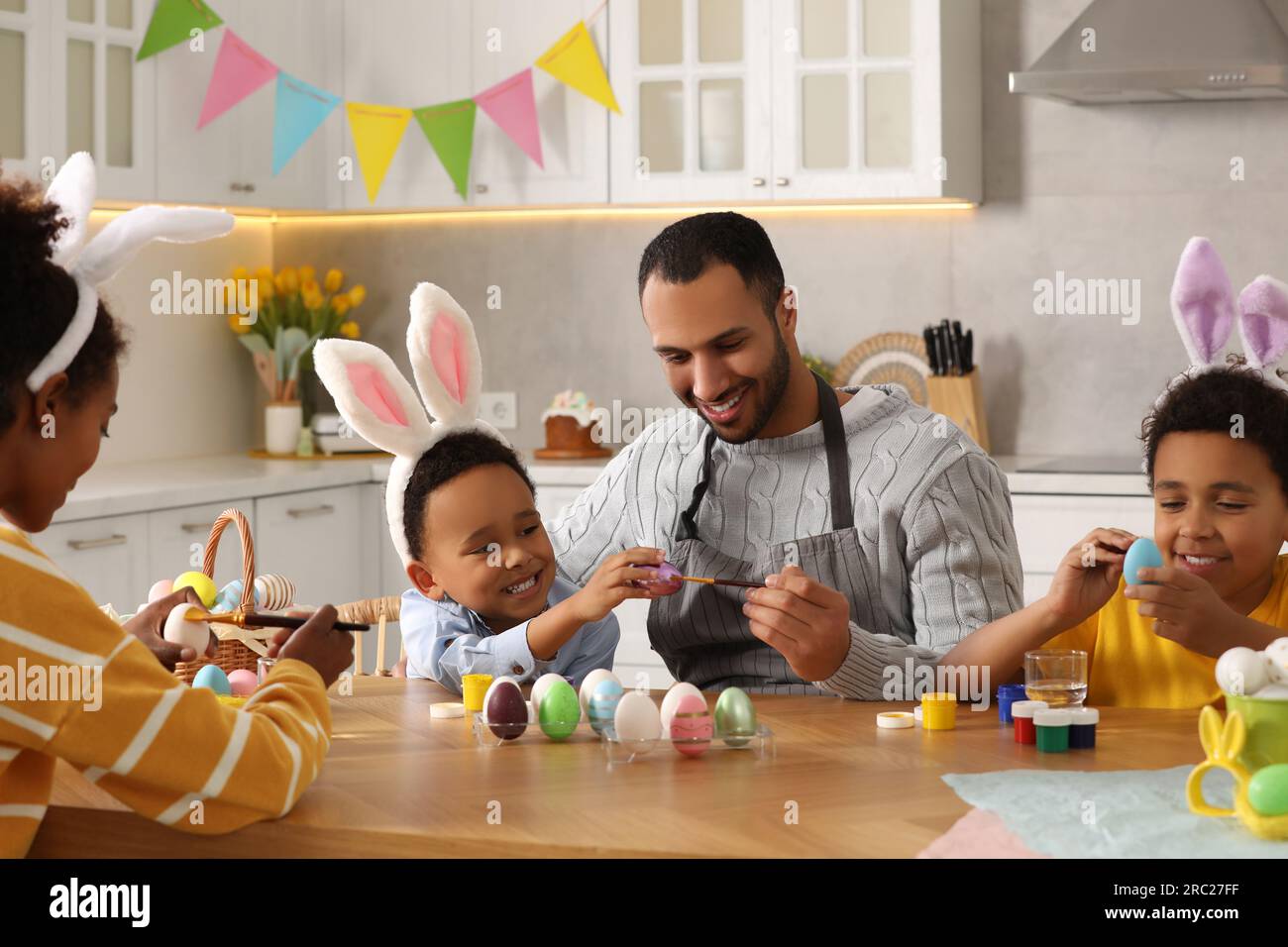 Happy african family easter eggs hi-res stock photography and images ...
