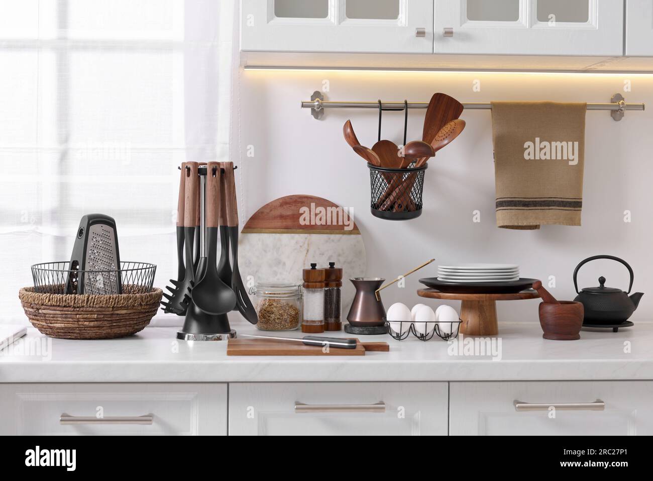 Set of different utensils and dishes on countertop in kitchen Stock ...