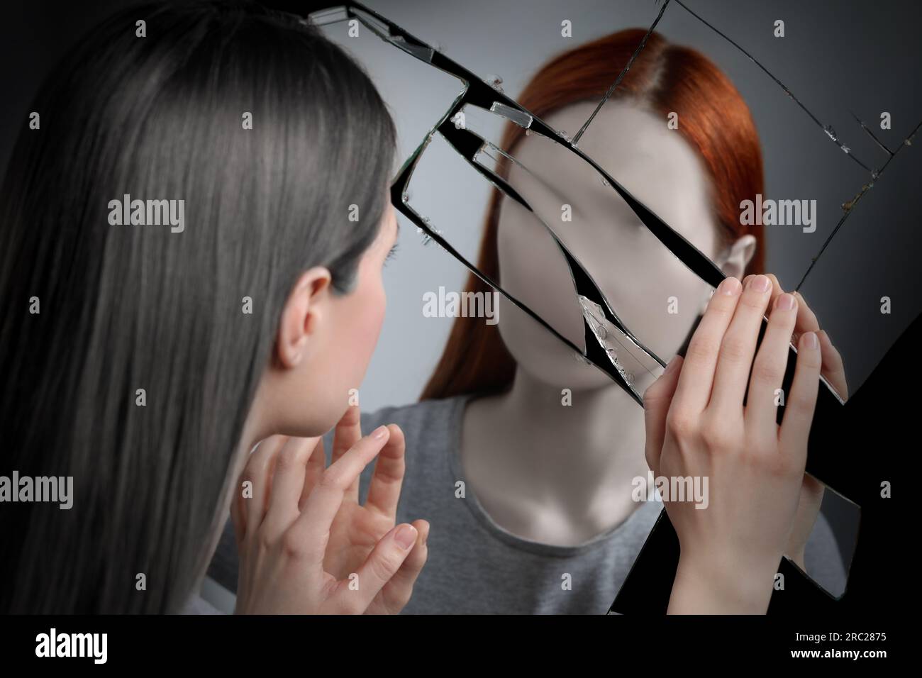 Suffering from hallucinations. Woman seeing her faceless reflection in ...